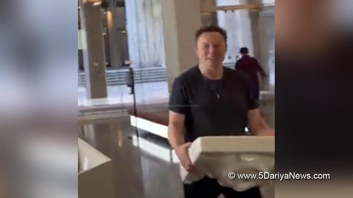 Elon Musk visits Twitter HQ, with a sink in his hand